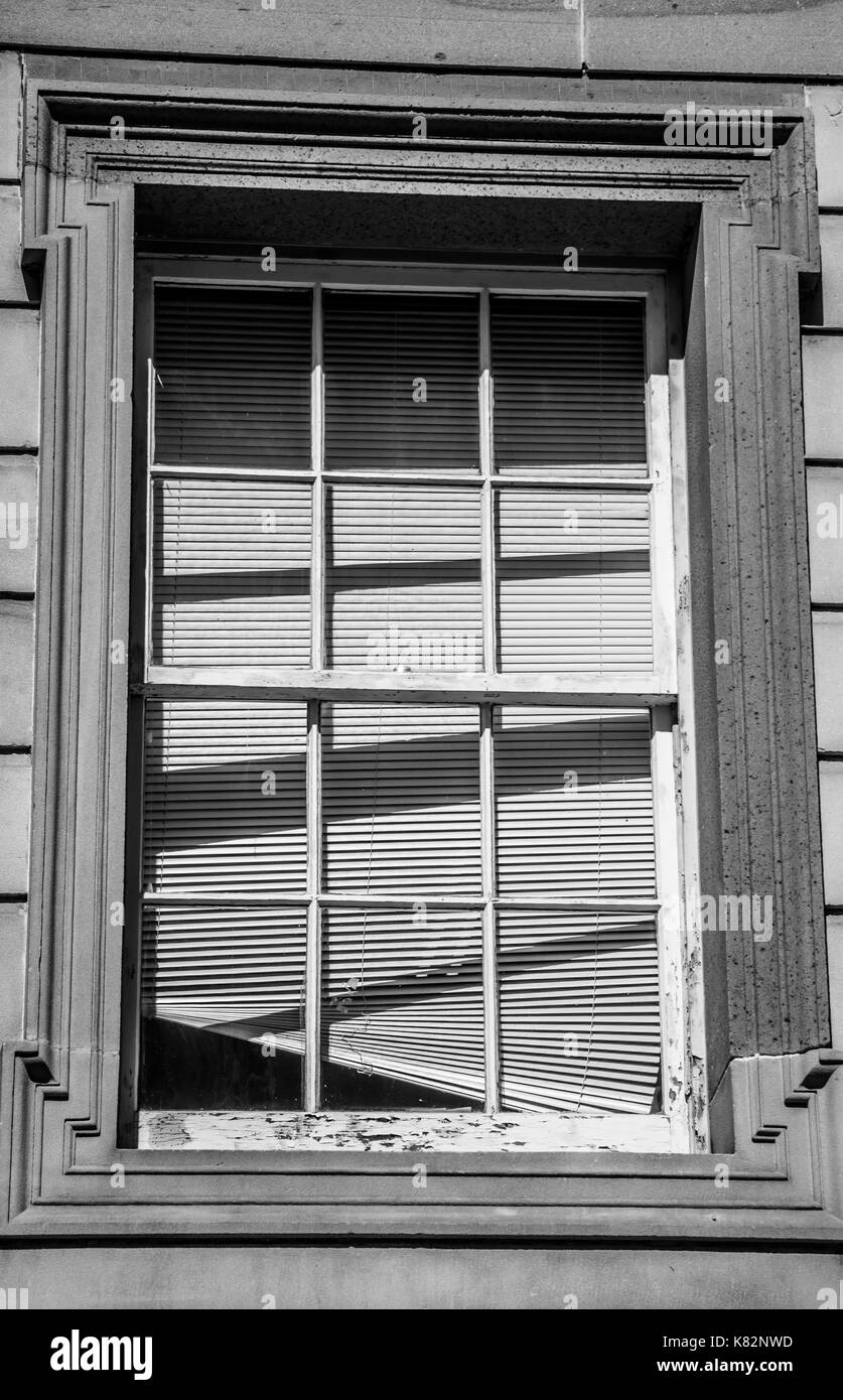 Black and white window with crooked venetian blind Stock Photo - Alamy