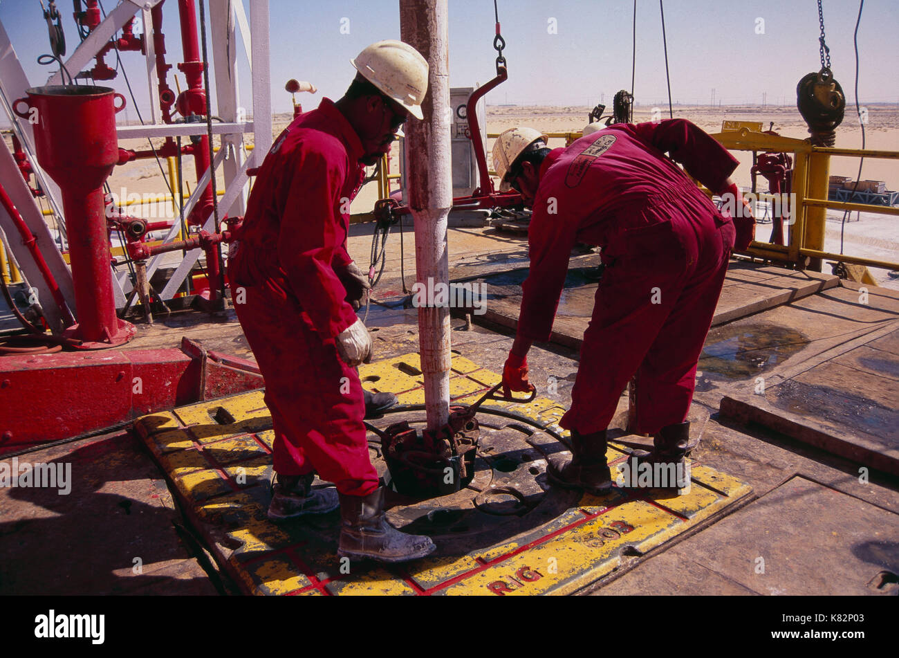 Drilling for oil in the Saudi desert near Abqaiq, by the Arabian ...