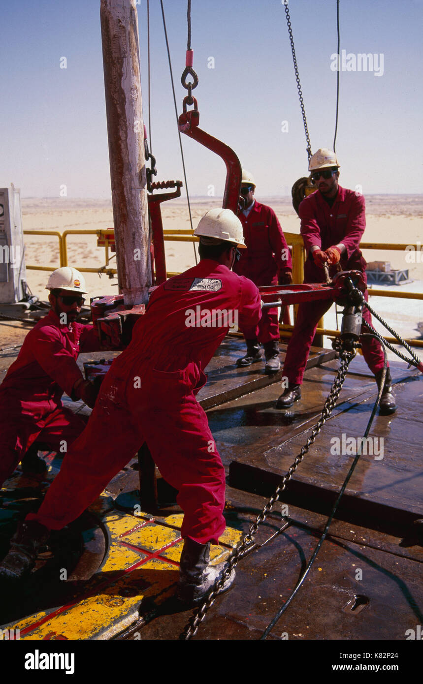 Drilling for oil in the Saudi desert near Abqaiq, by the Arabian ...