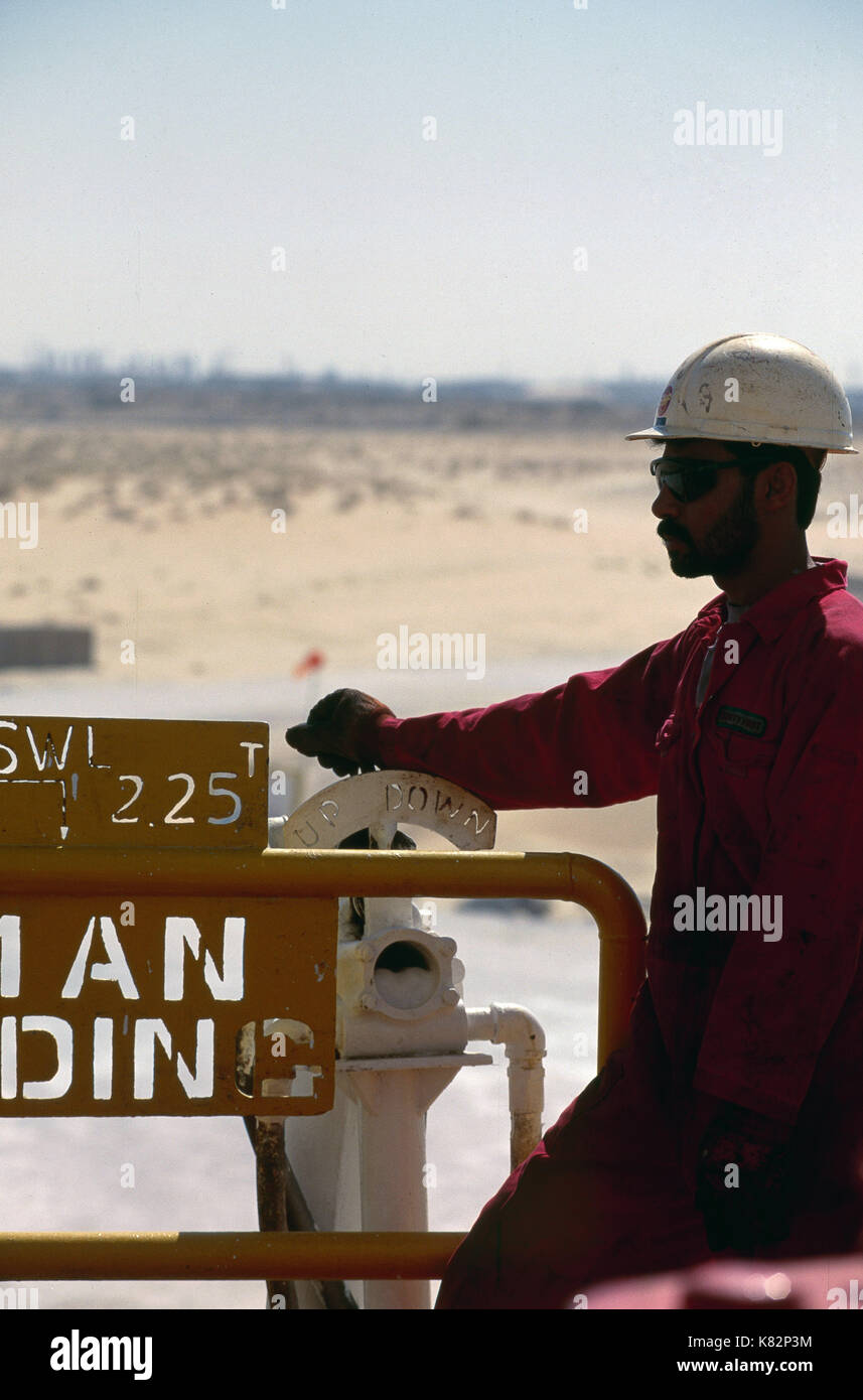 Drilling for oil in the Saudi desert near Abqaiq, by the Arabian ...