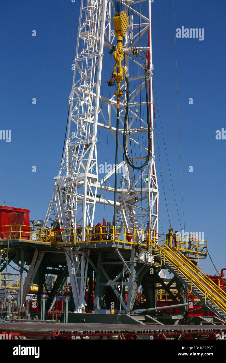 Drilling for oil in the Saudi desert near Abqaiq, by the Arabian ...
