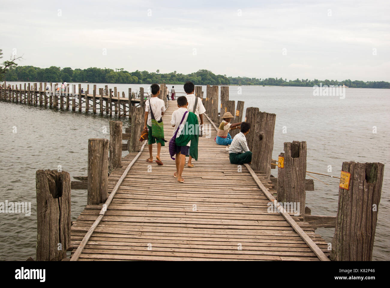 School children walking across the Longest Teak Bridge in the world, U ...