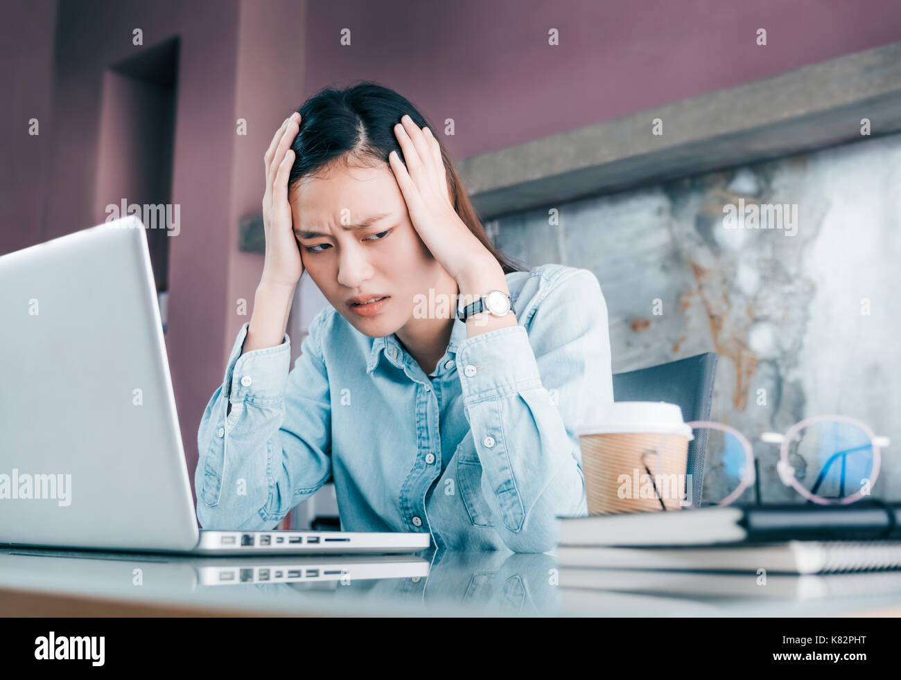 Stressed Asian businesswoman cover her face with hand and feel ...