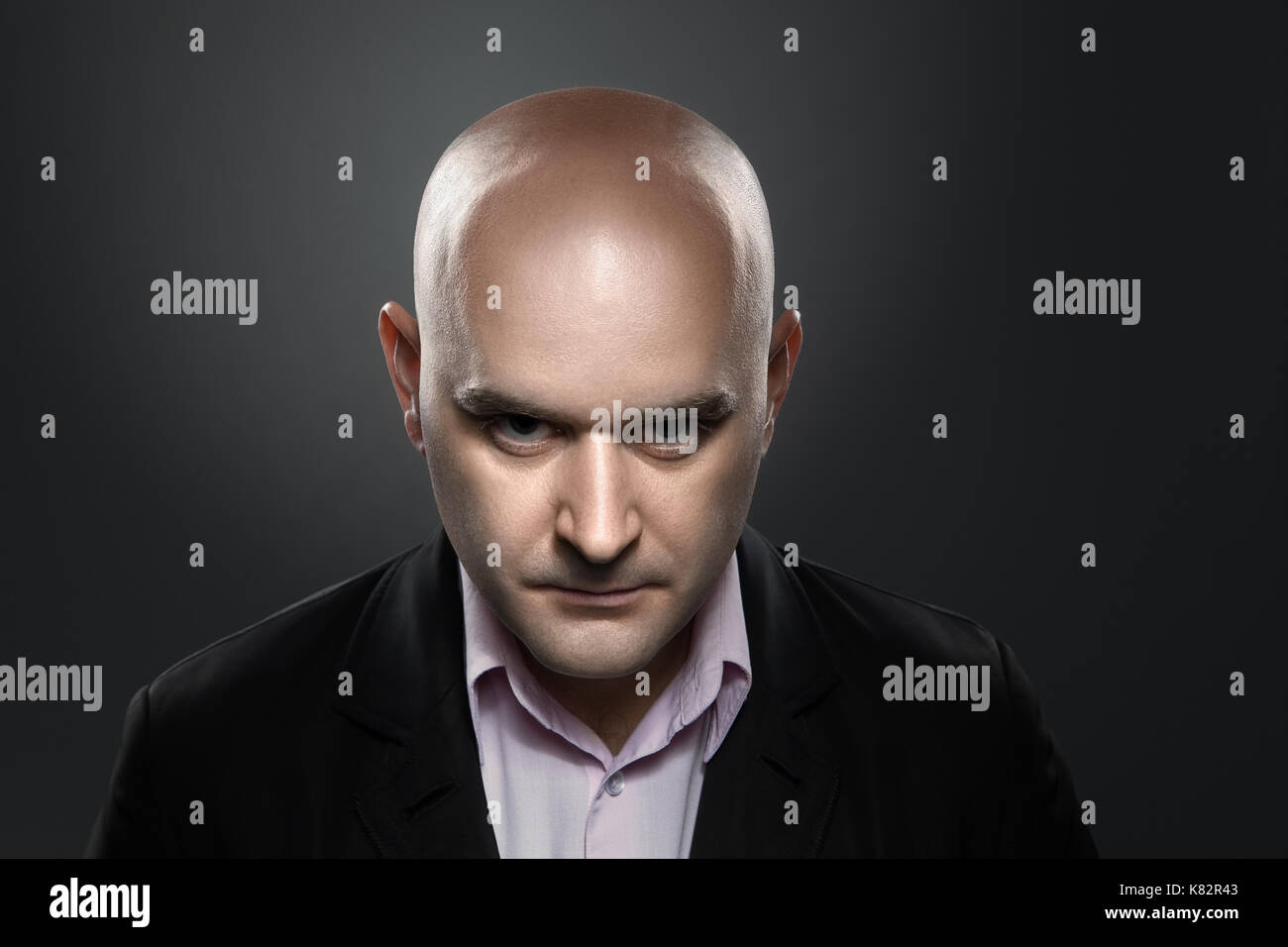 Portrait of a man with angry expression in dark Stock Photo - Alamy