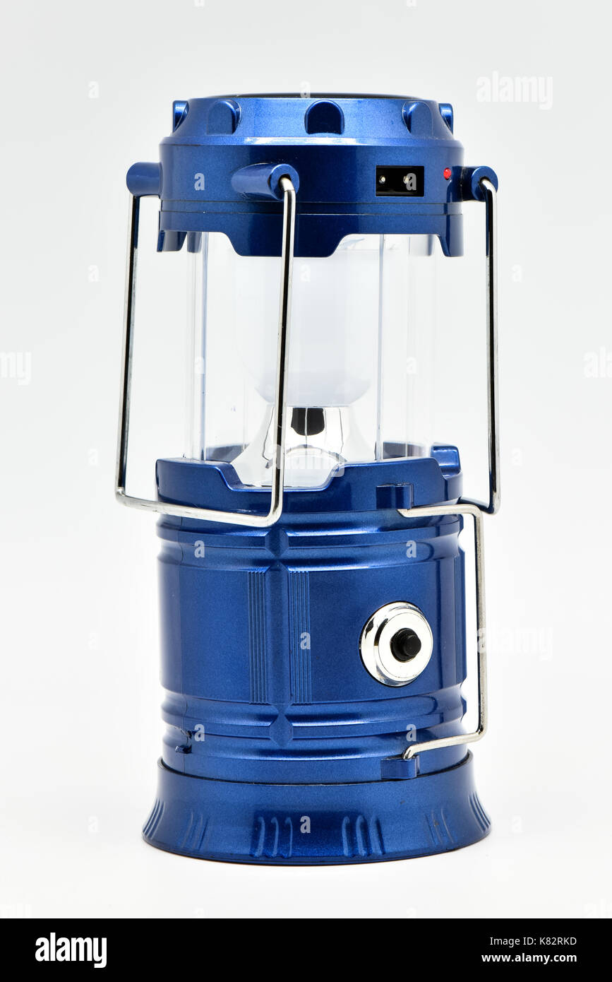 blue multifunction rechargeable flashlight isolated with white ...