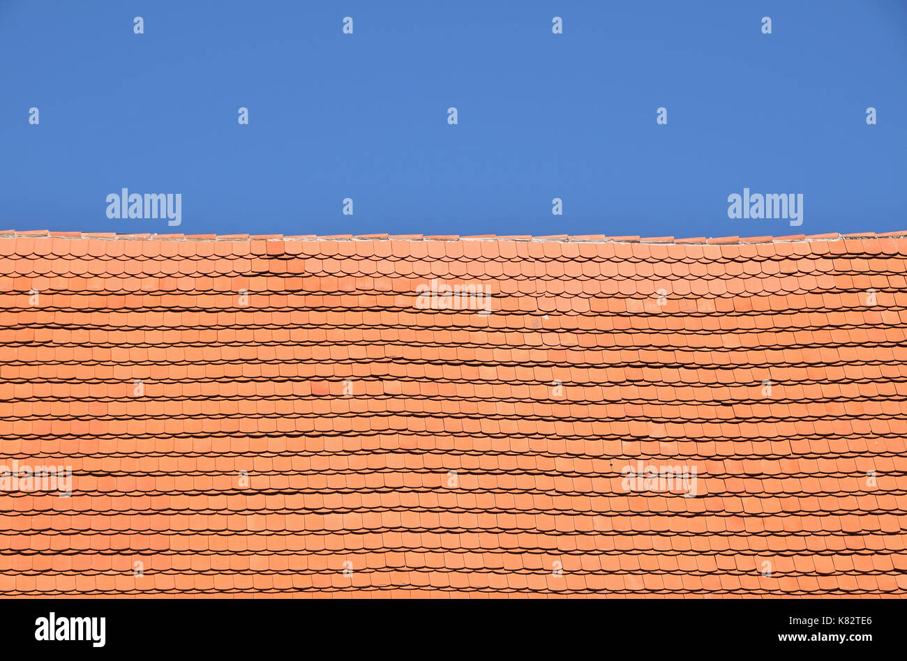 Traditional red brown ceramic roof tiles pattern over background of ...