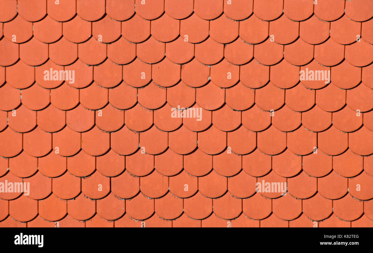 Traditional red brown ceramic roof tiles pattern background, close up ...
