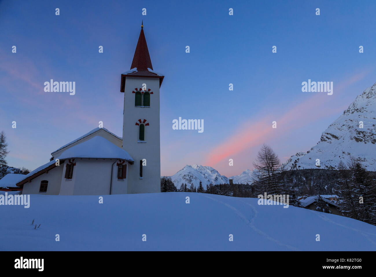 Chiesa Bianca surrounded by snow, Maloja, Bregaglia Valley, Canton of ...