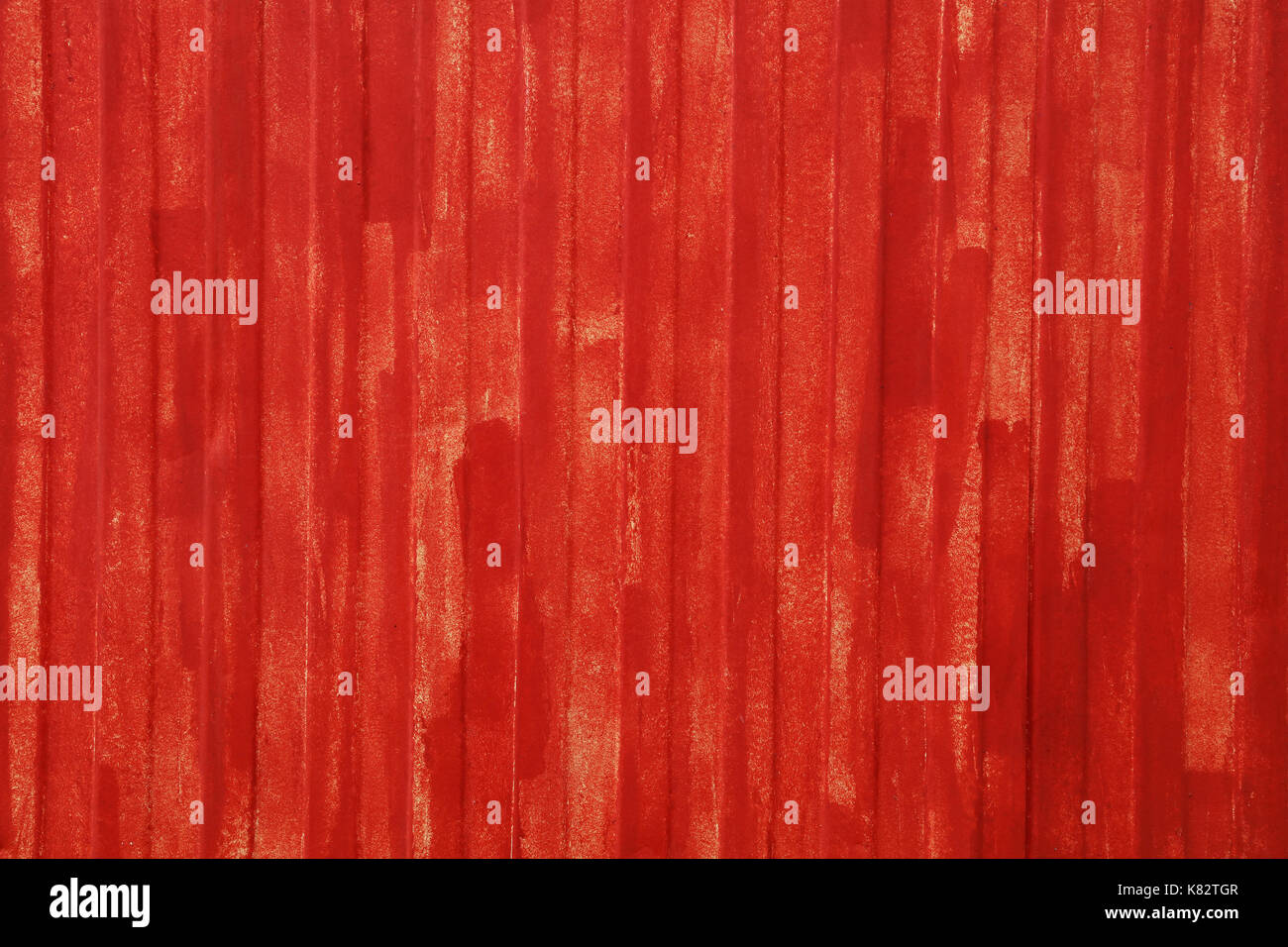 Abstract background texture of red painted vivid metal wall surface ...