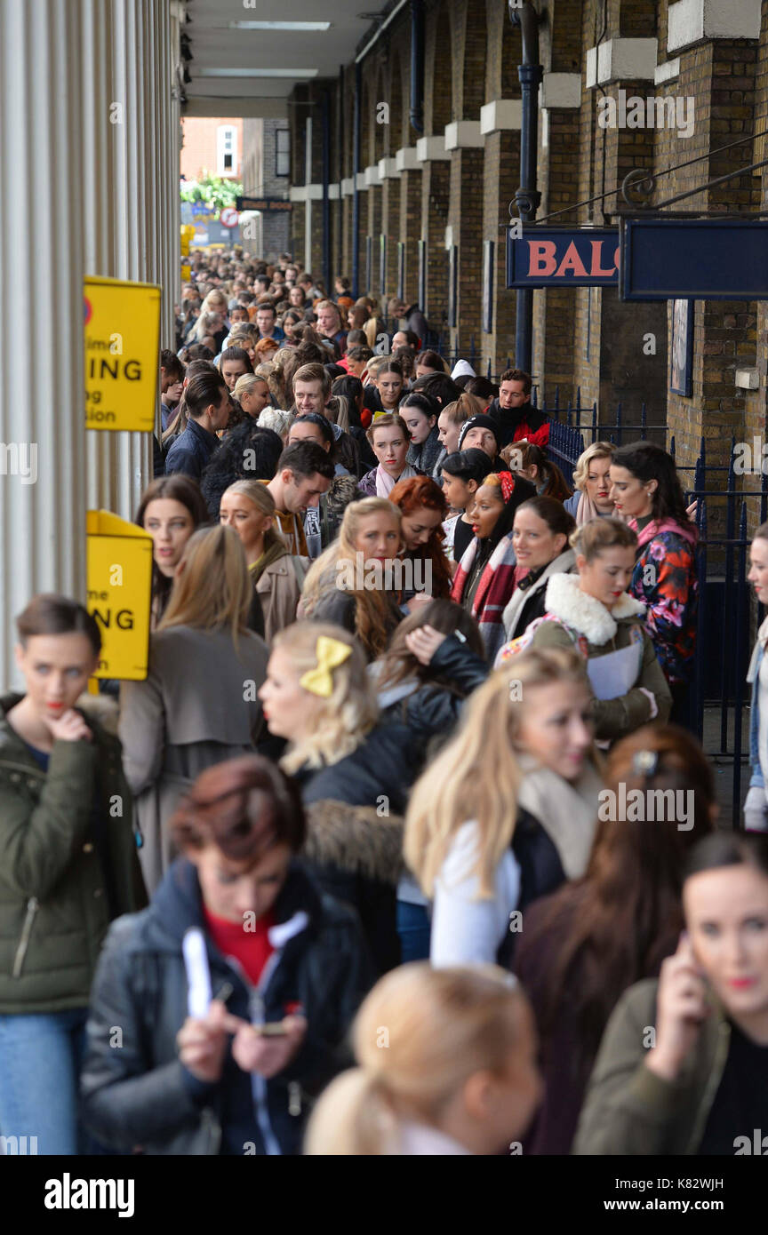 People queue outside Theatre Royal Drury Lane in London as auditions ...