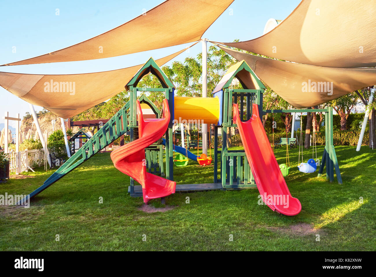 Colorful playground in the yard in the park at sunset Stock Photo - Alamy