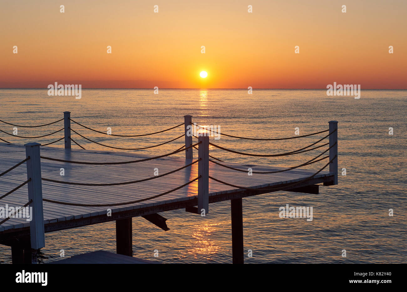 Wooden bridge pier against a beautiful sky measure used for natural ...