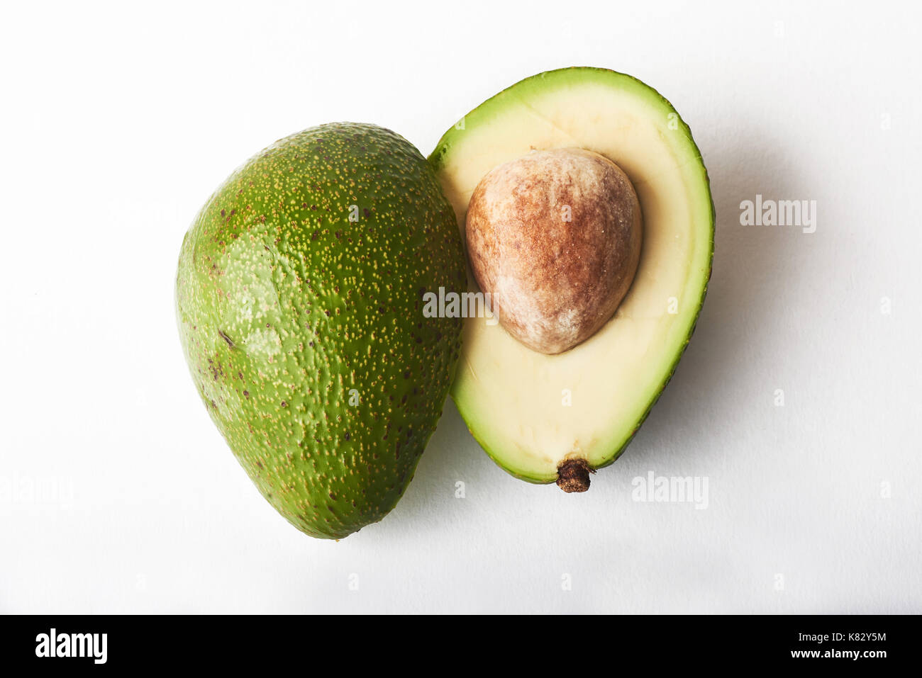 2 parts avocado isolated on white background Stock Photo - Alamy