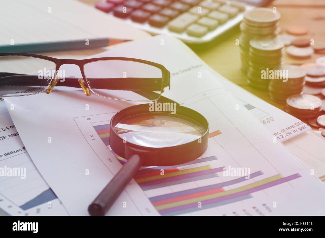 business object,graph paper,magnifier and calculator on table, concept ...