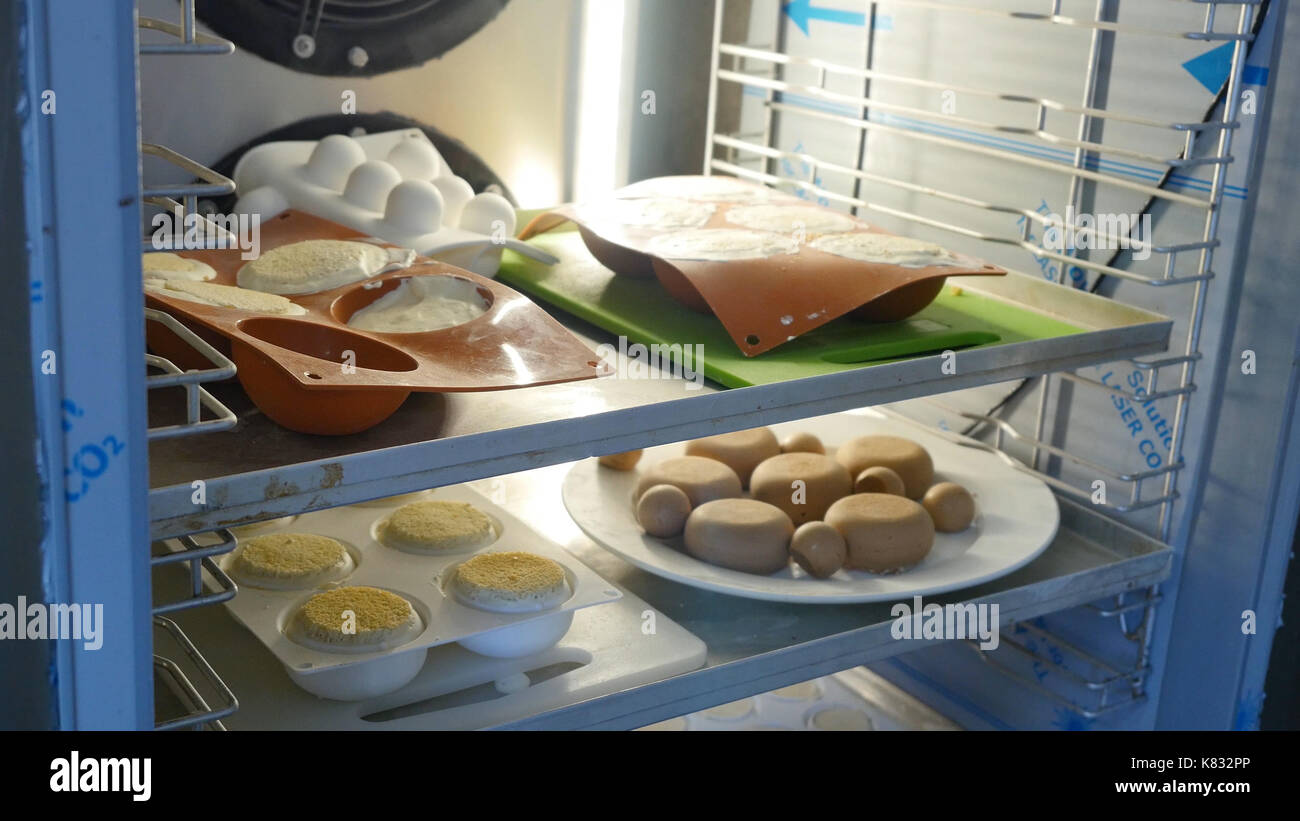 Pastry in the fridge in a candy store Stock Photo - Alamy