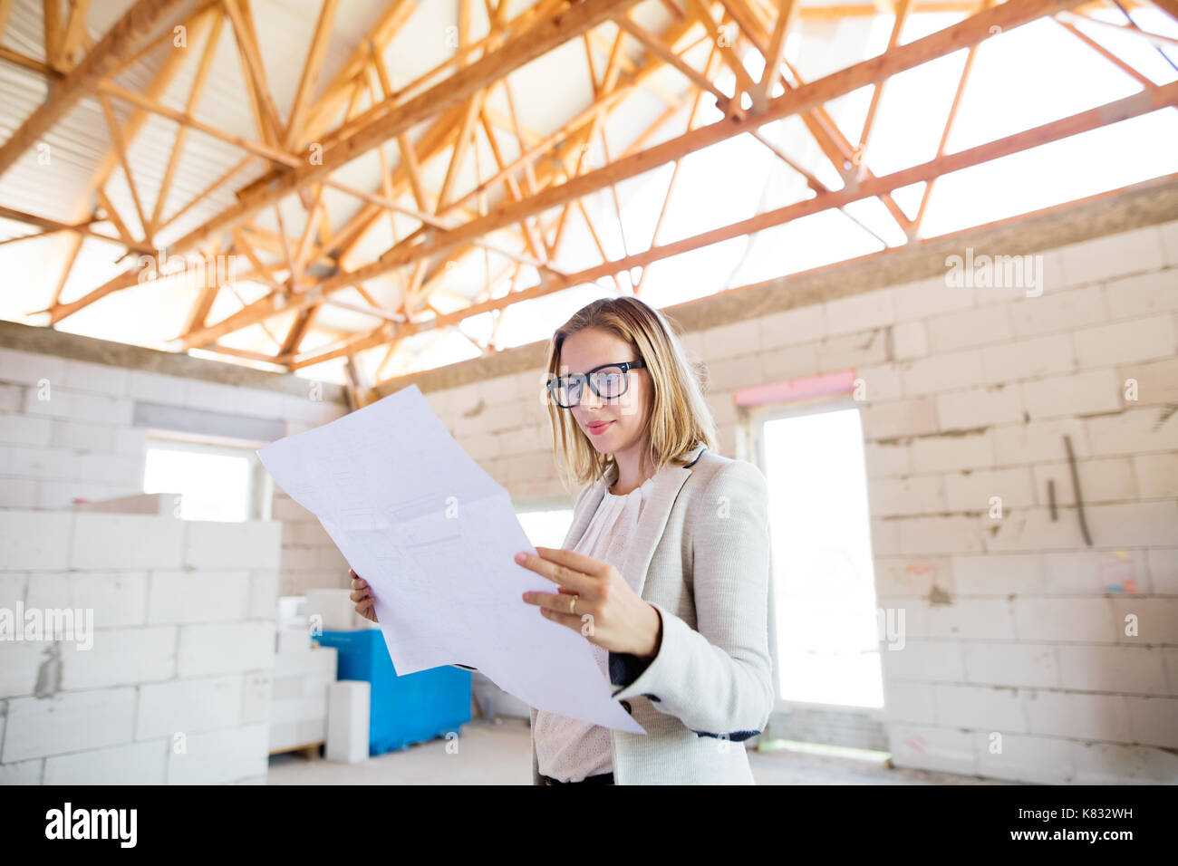 Engineer working blueprints construction project hi-res stock ...