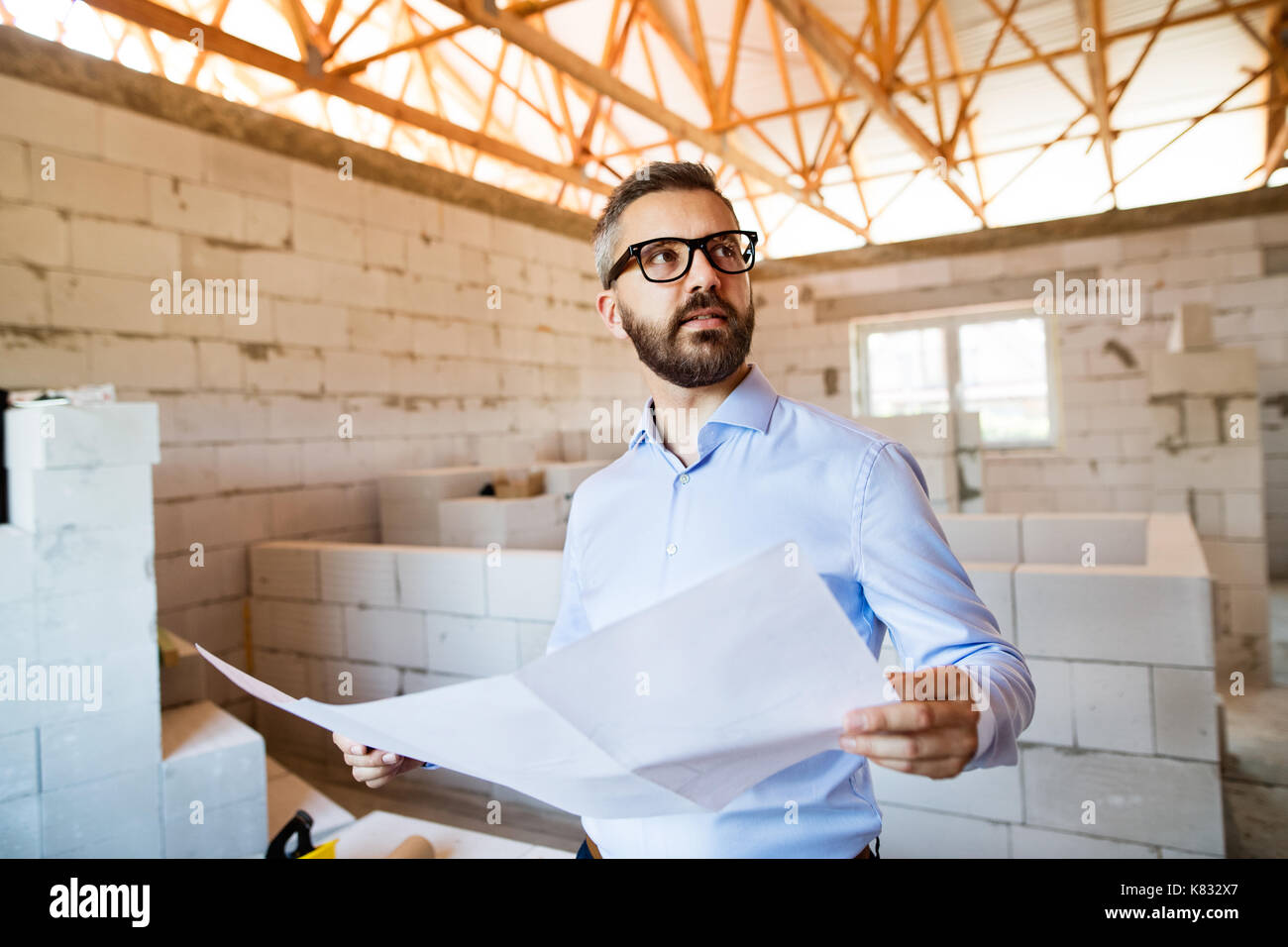 Architect or civil engineer at the construction site Stock Photo - Alamy