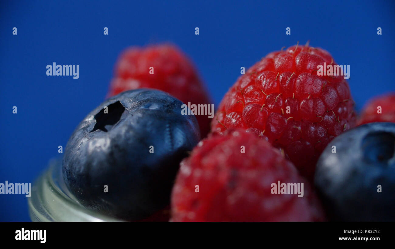 Fresh fruits - blueberry, raspberry. beautifully lined with raspberries ...