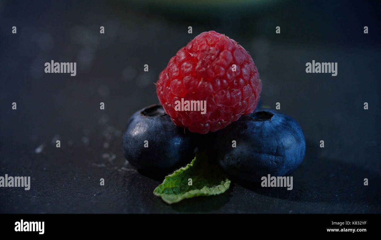 Fresh fruits - blueberry, raspberry. beautifully lined with raspberries ...