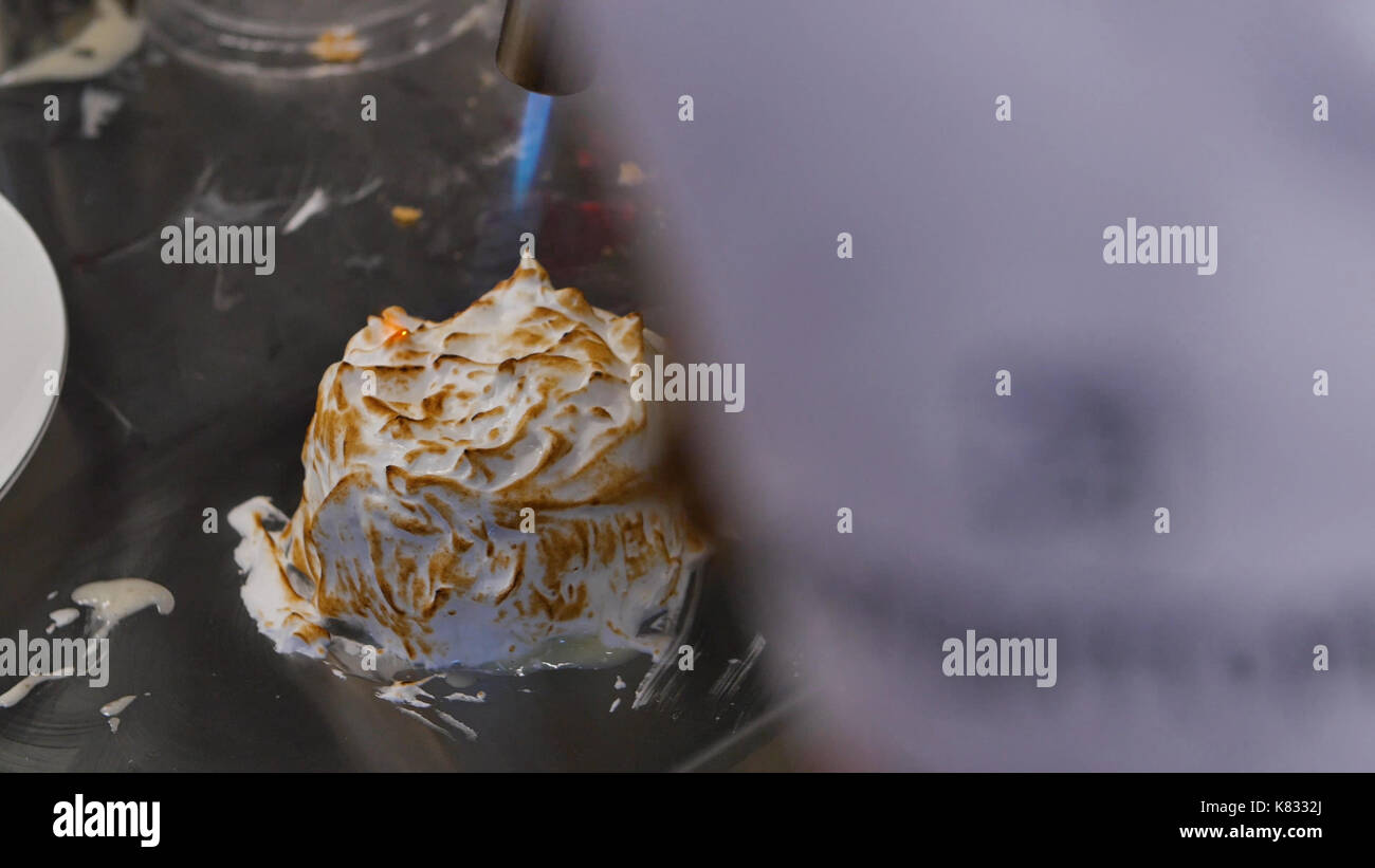Closeup of a cream brule. Burning cream burner. Cream on the cake Stock ...