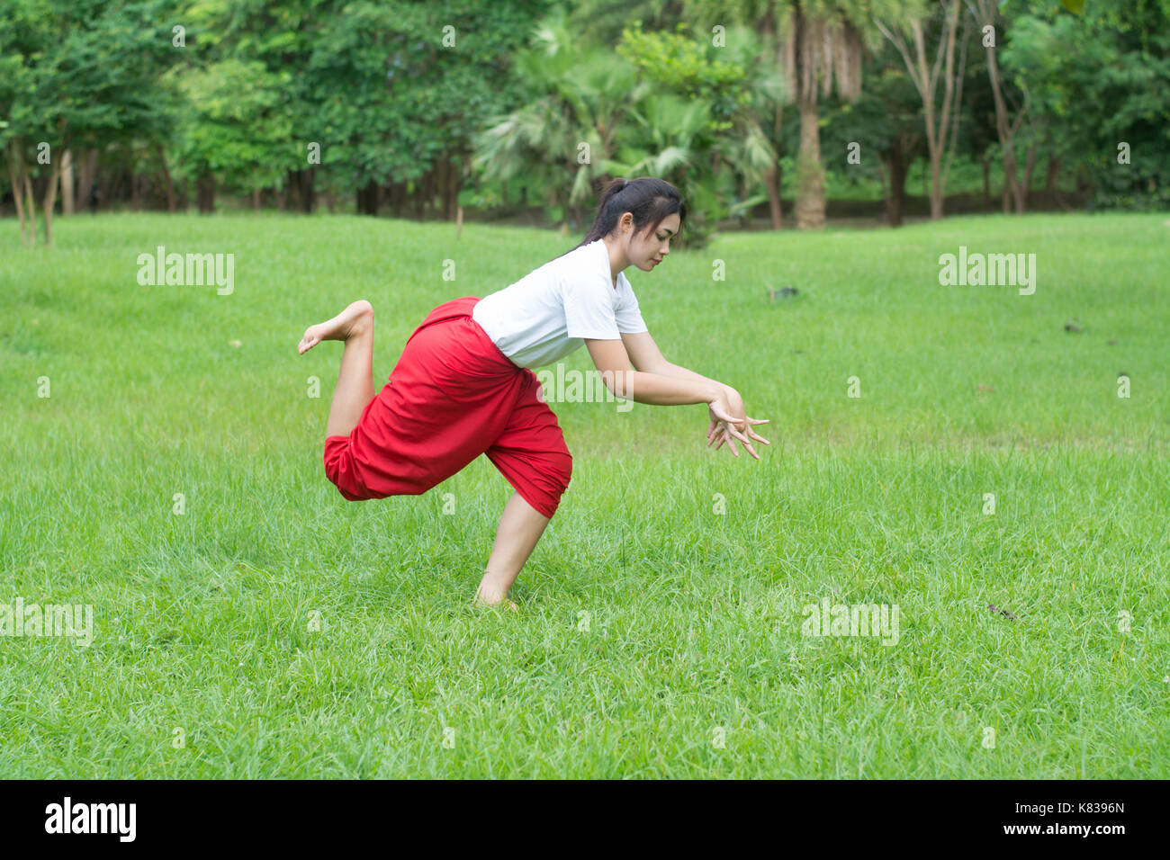 Asian young girl learning Thai dance. Classical Dance in white shirt ...
