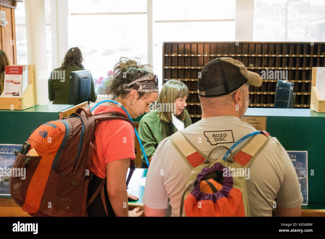 Couple successfully checking in into the Swiftcurrent Lodge / hotel in ...