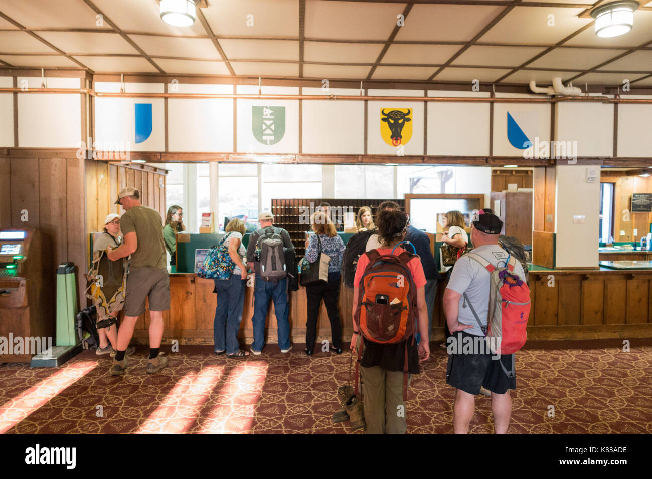 Guests waiting in line at the reception to check in into the ...