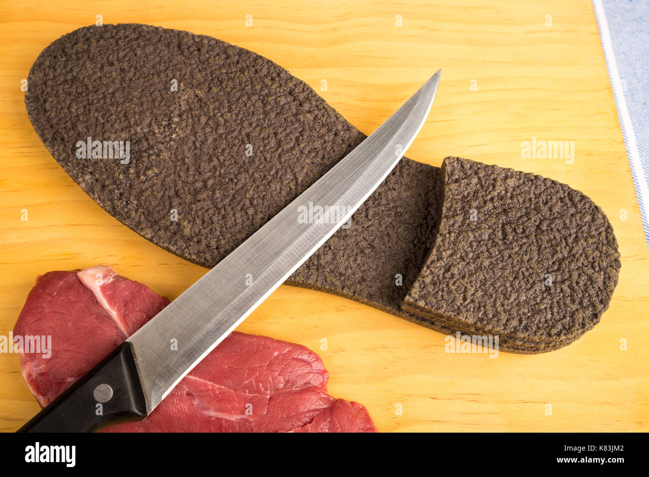Beef steak next to a shoe sole, a poor quality meat concept Stock Photo ...