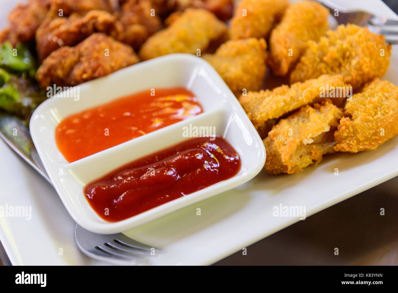 Chicken Karake in the disk with sauce Stock Photo - Alamy