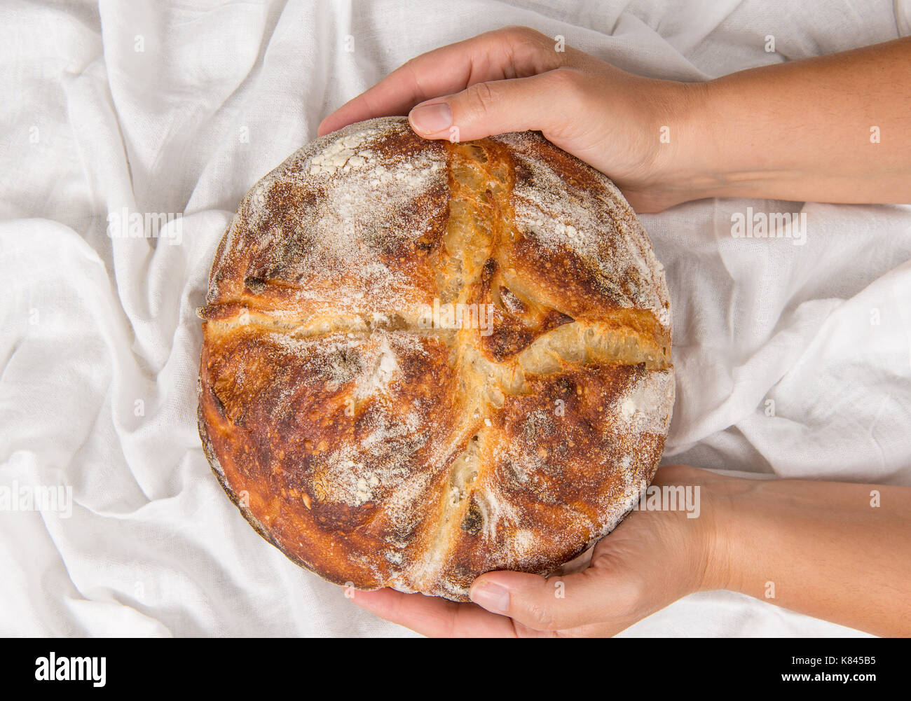 Holding a loaf of bread in his hands hi-res stock photography and ...