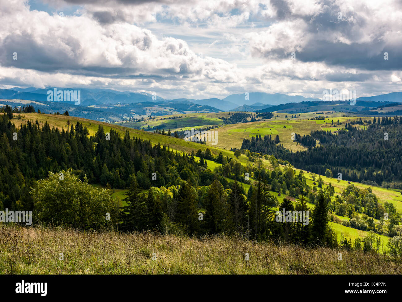 beautiful countryside landscape with rural fields in mountains on a ...