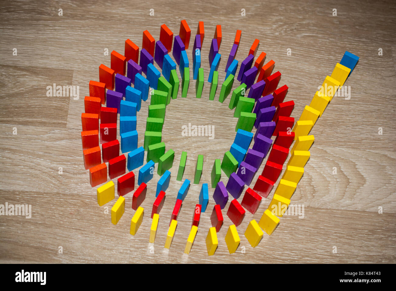Colorful Domino Blocks in a line on a white background Stock Photo - Alamy