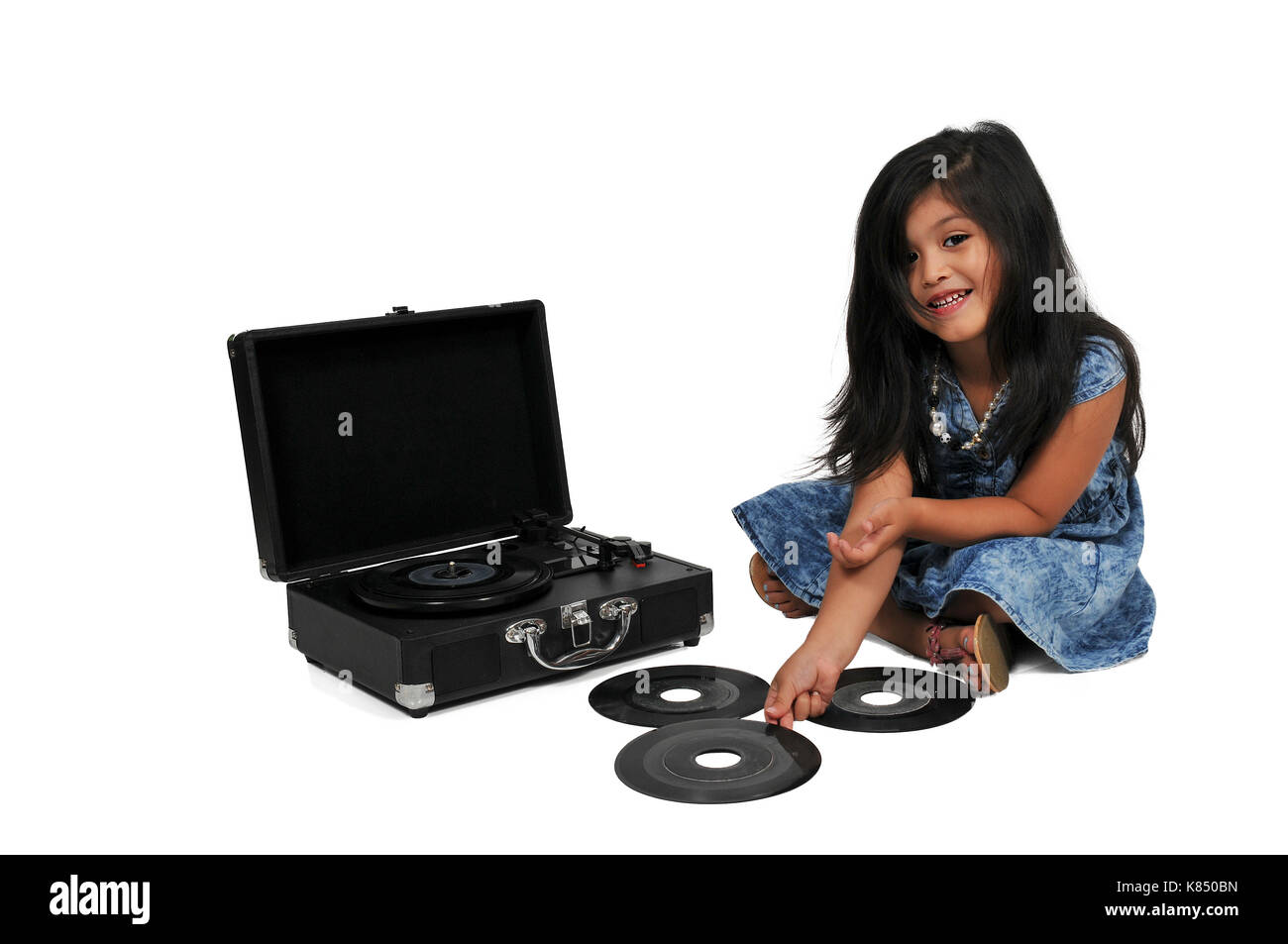 Little girl with vintage vinyl 45 single record and player Stock Photo ...