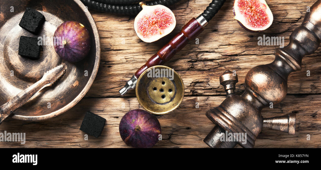 Exotic smoked shisha with tobacco with a taste of fig fruit Stock Photo ...