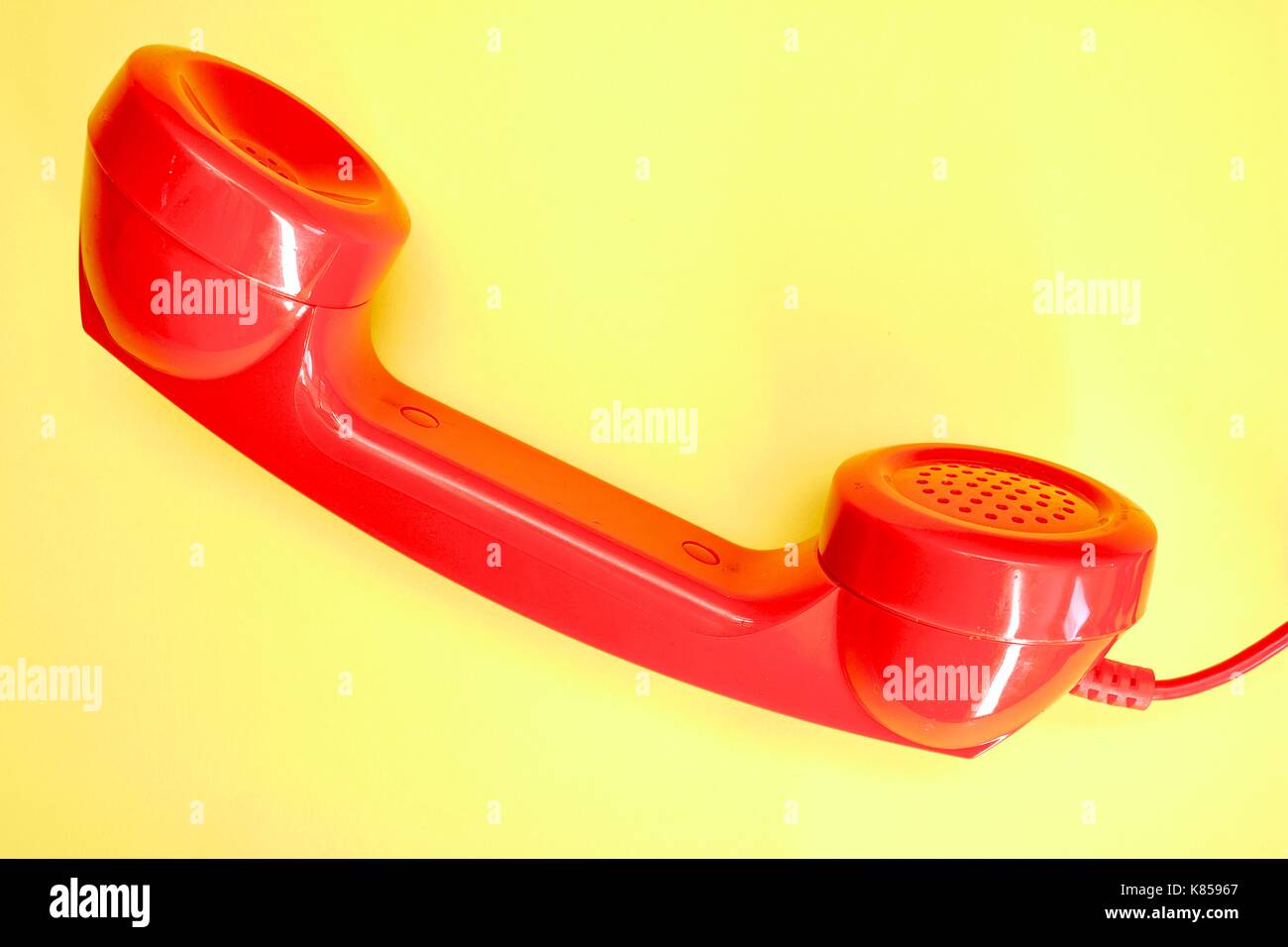 A studio photo of a red rotary telephone Stock Photo - Alamy