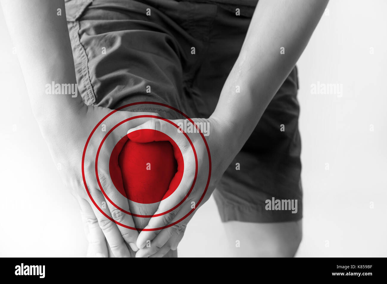 the knee man holds on suffering from pain in knee Closeup. The lesion ...