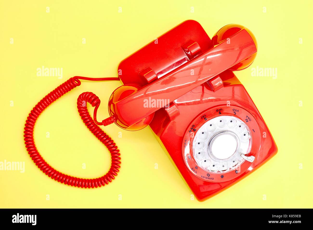 A studio photo of a red rotary telephone Stock Photo - Alamy