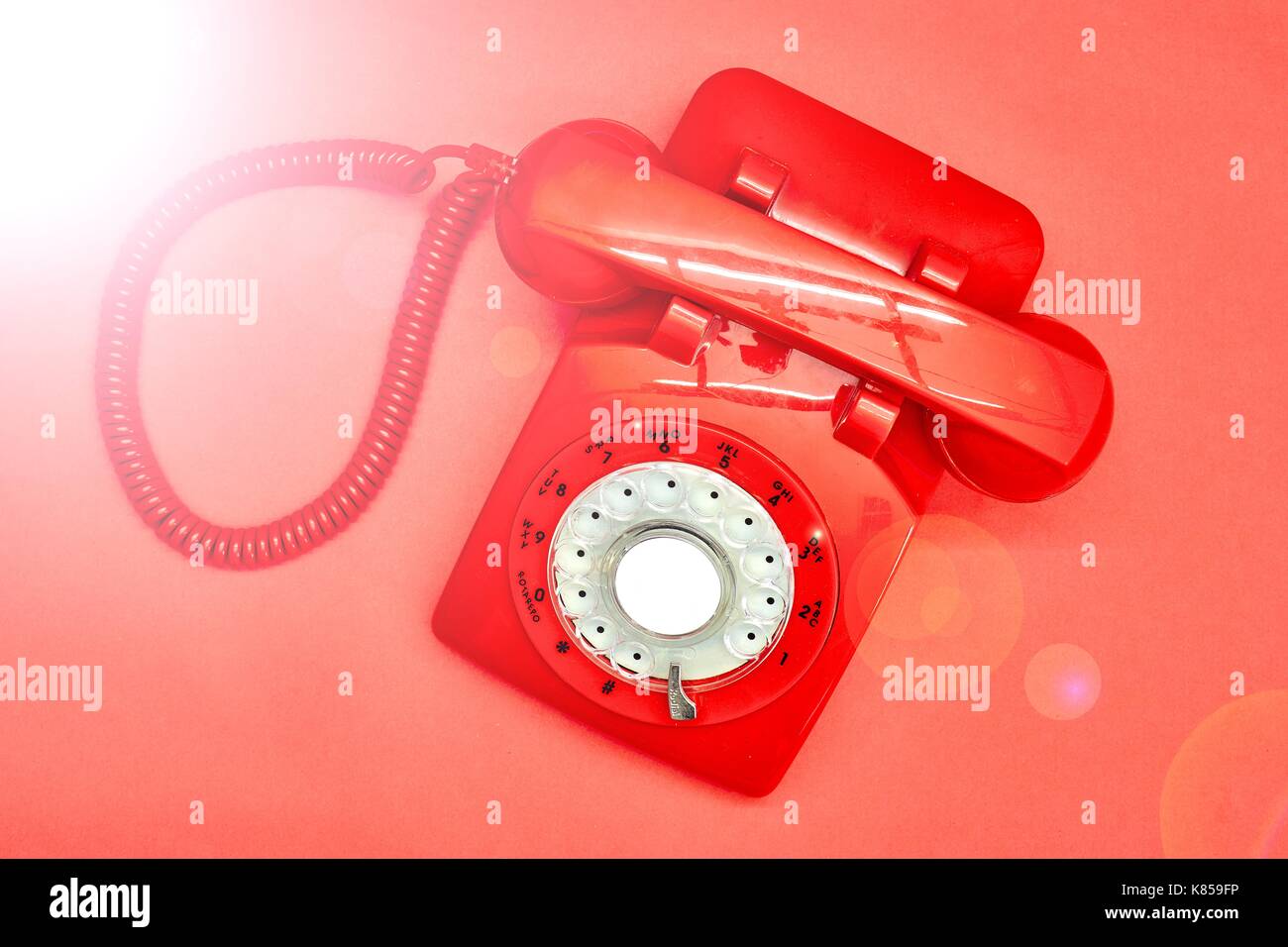 A studio photo of a red rotary telephone Stock Photo - Alamy