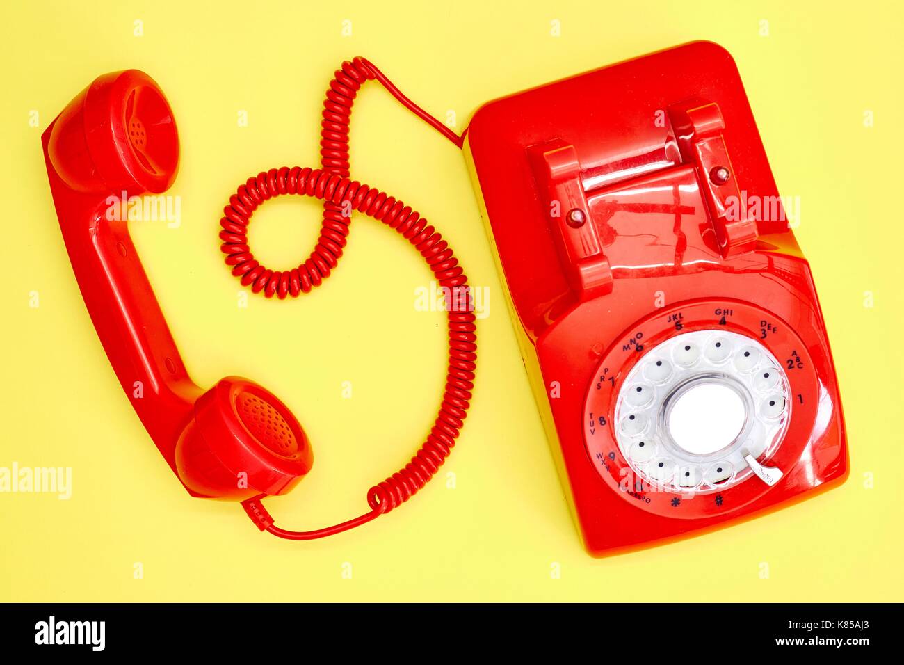 A studio photo of a red rotary telephone Stock Photo - Alamy