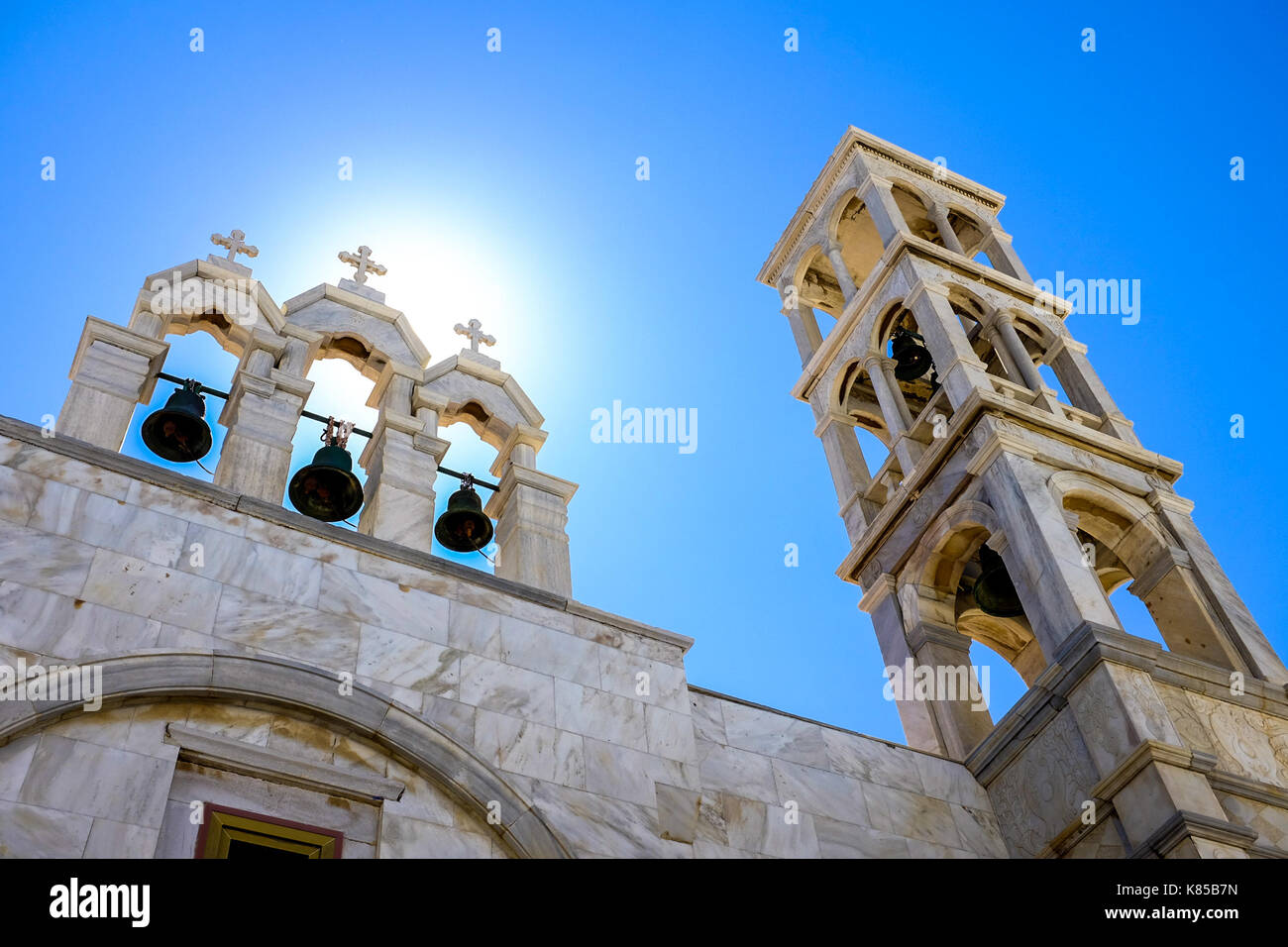 The Monastery of Panagia Tourliani in Mykonos, Greece. People light ...
