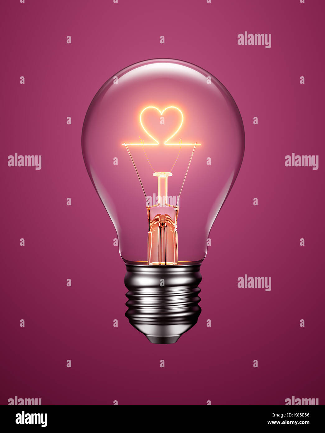 Light bulb with filament forming a heart icon on purple background ...
