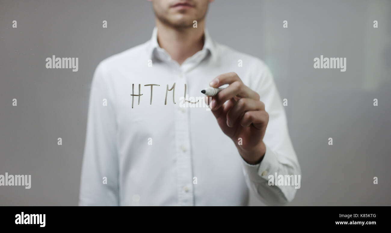 HTML , Man Writing on Glass Stock Photo - Alamy