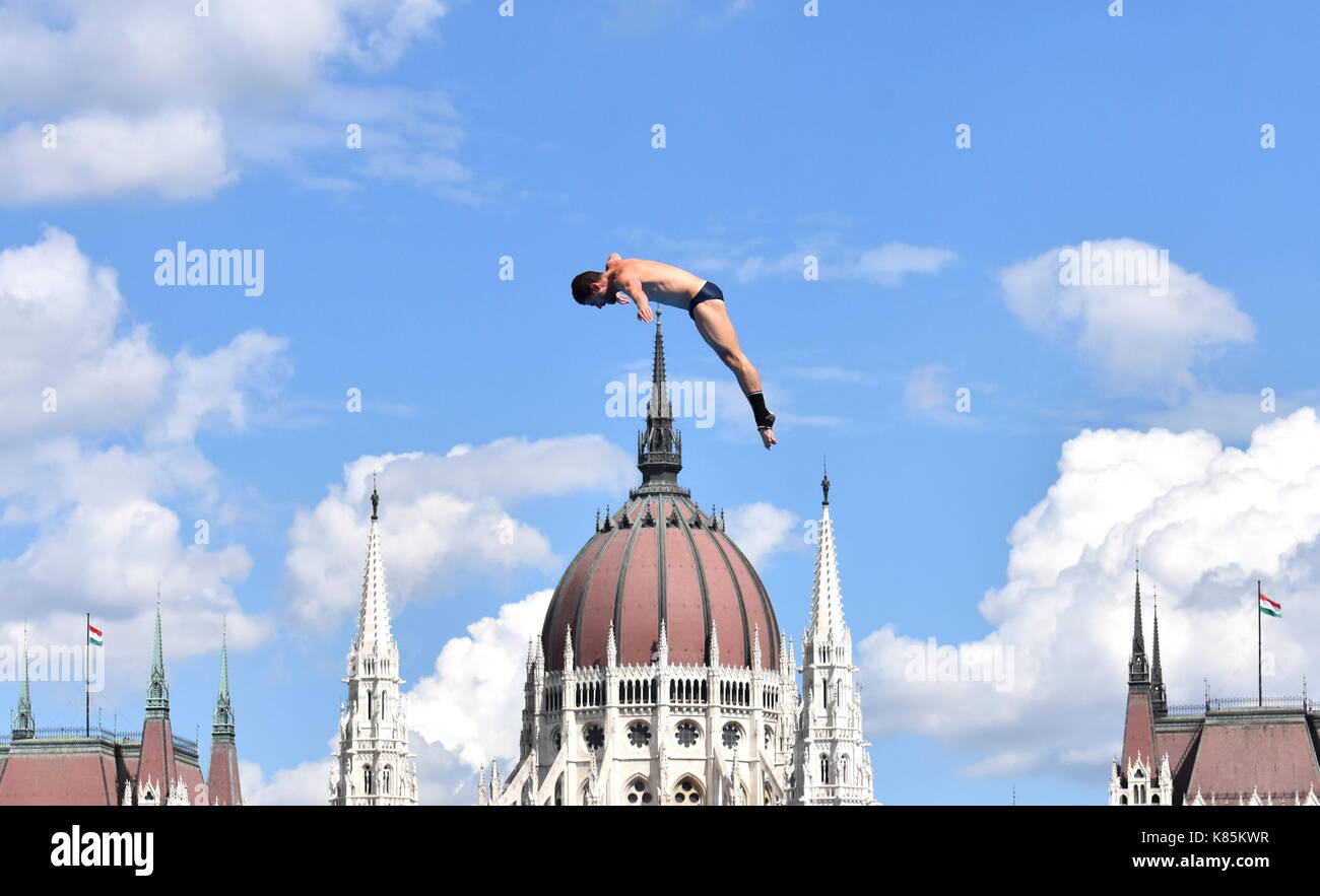 Budapest, Hungary - Jul 28, 2017. Man dives from the 27 metre platform ...