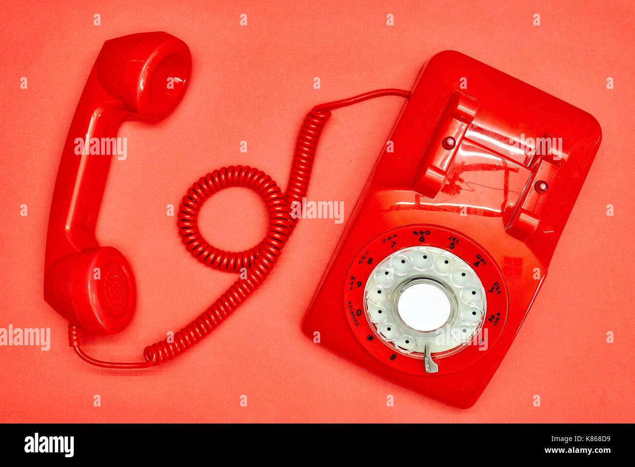 A studio photo of a red rotary telephone Stock Photo - Alamy