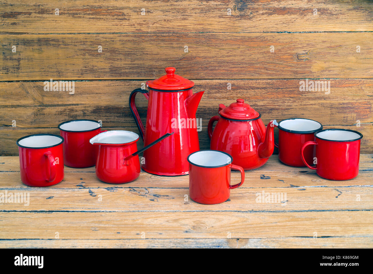 teapot, jug for milk and cups of red color Stock Photo - Alamy