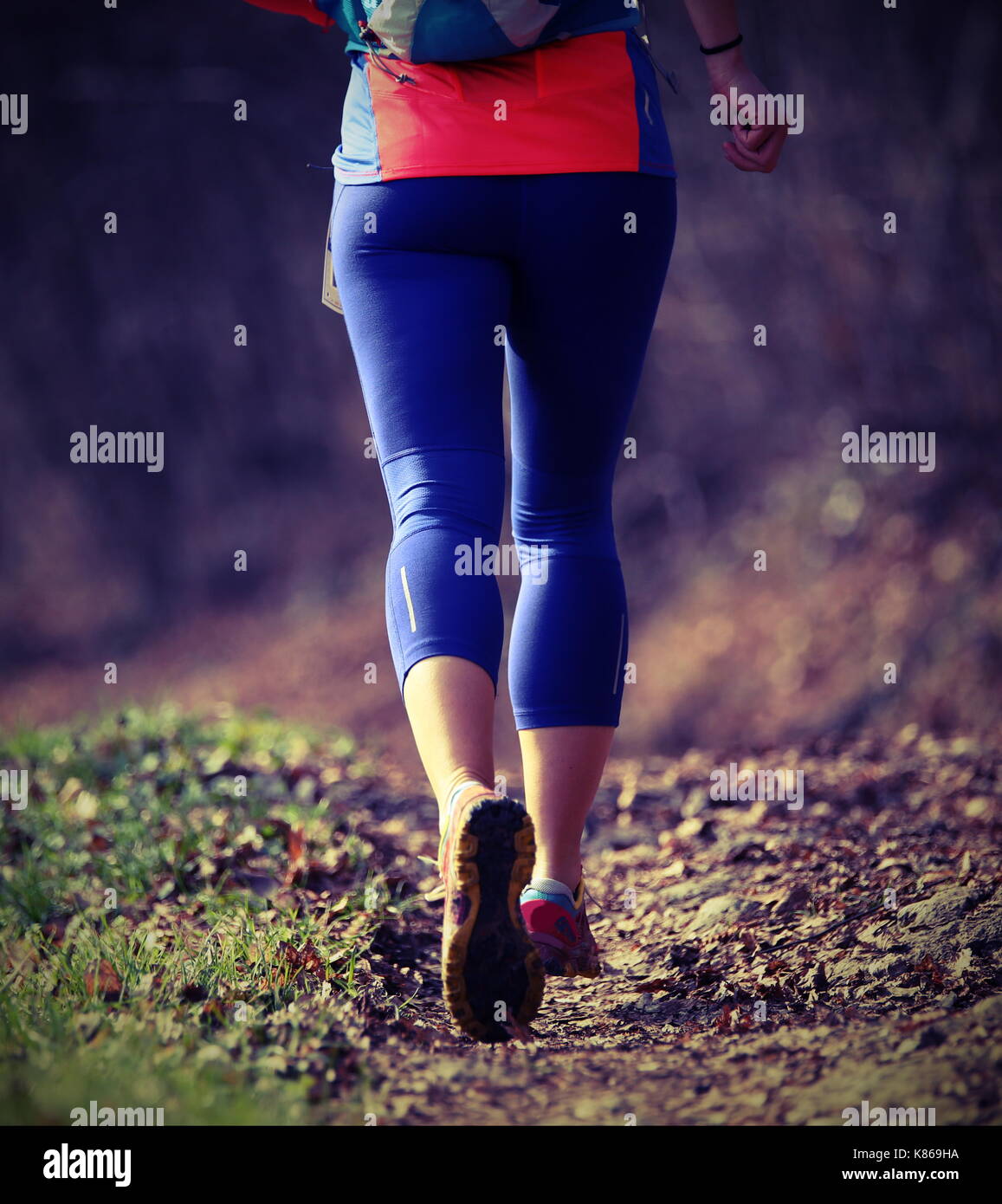 legs of an isolated runner during cross-country running in the woods in ...