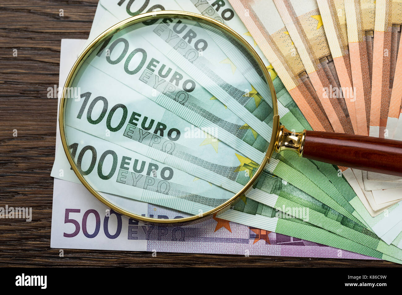 Close-up Of Magnifying Glass Over Euro Banknote Stock Photo - Alamy