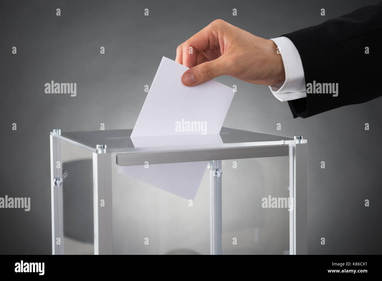 Voting hands ballot box hi-res stock photography and images - Alamy
