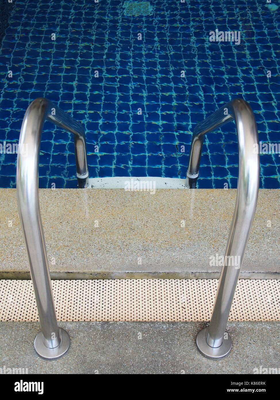 Swimming Pool Ladder, with a Clear Water Stock Photo - Alamy