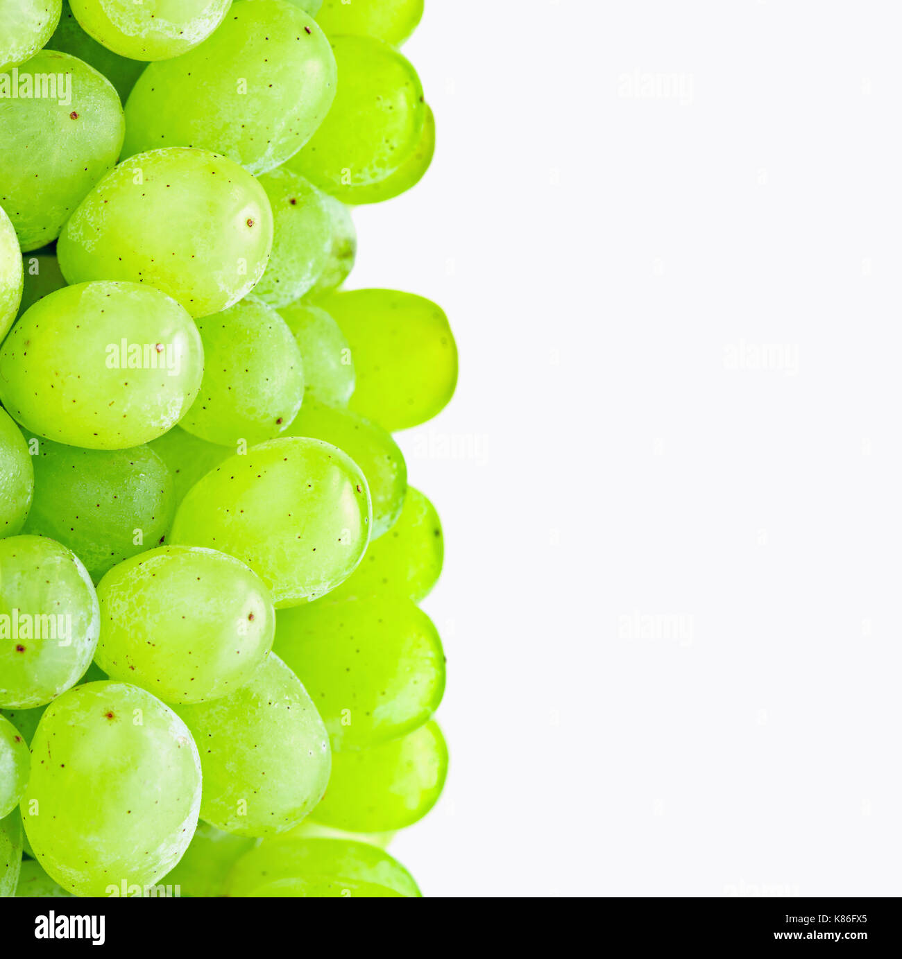 Very fresh green grapes on white background Stock Photo - Alamy